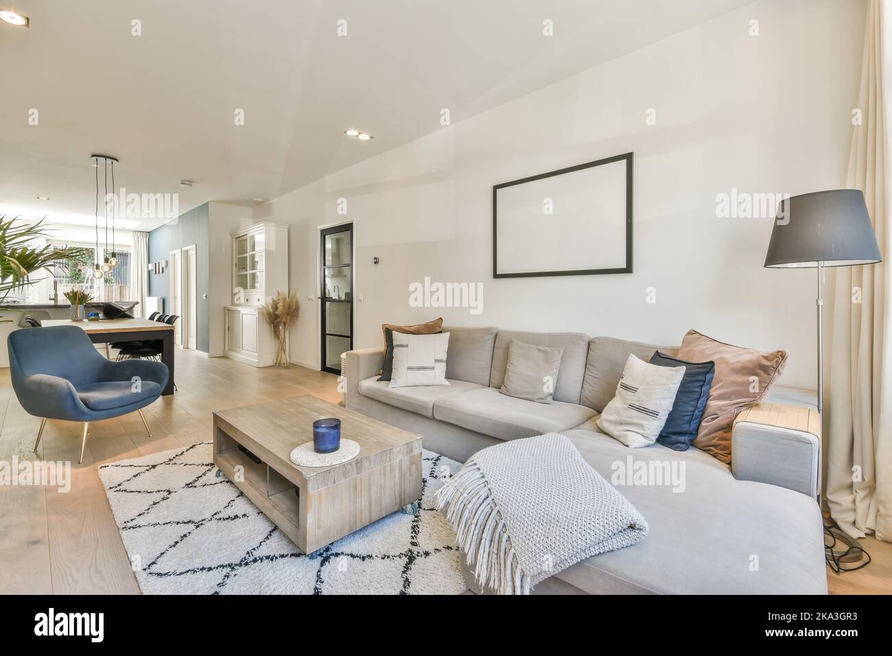 Interior of light living room with modern furniture and dining zones in ...