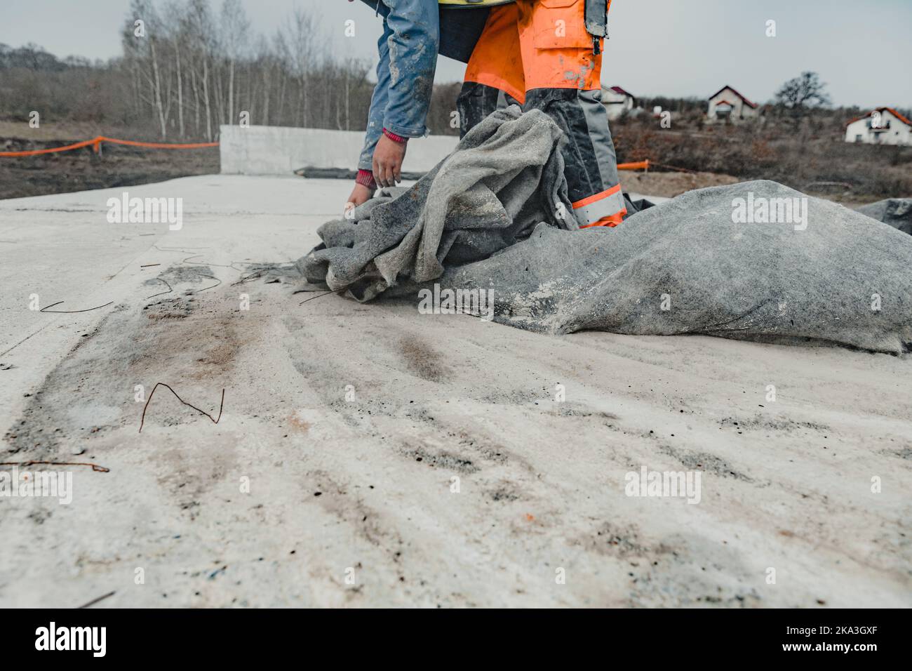 A construction worker doing concrete laying Stock Photo - Alamy