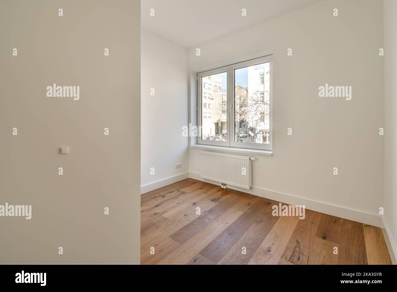 Interior of spacious empty unfurnished room with white walls and ...