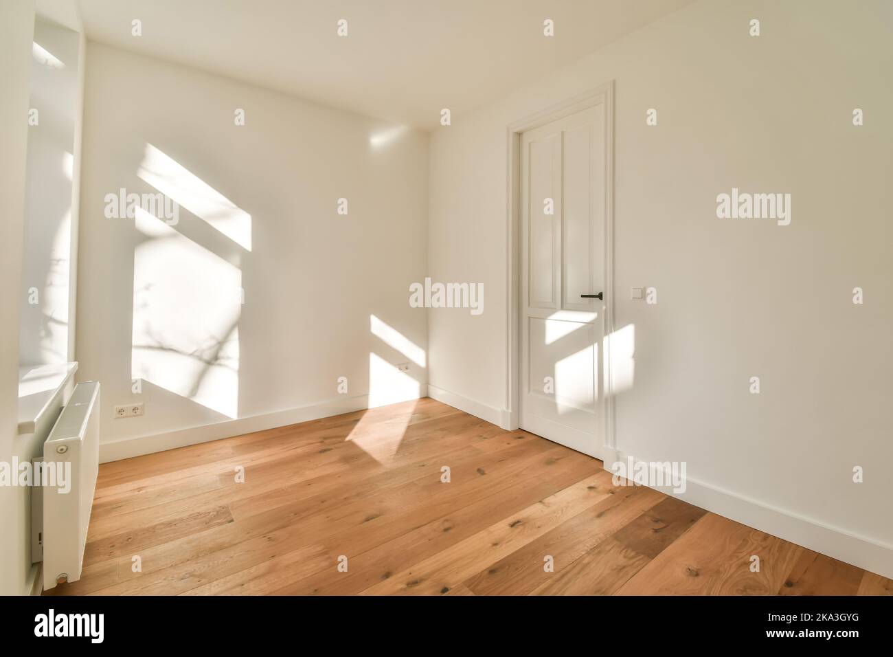 Interior of spacious empty unfurnished room with white walls and ...