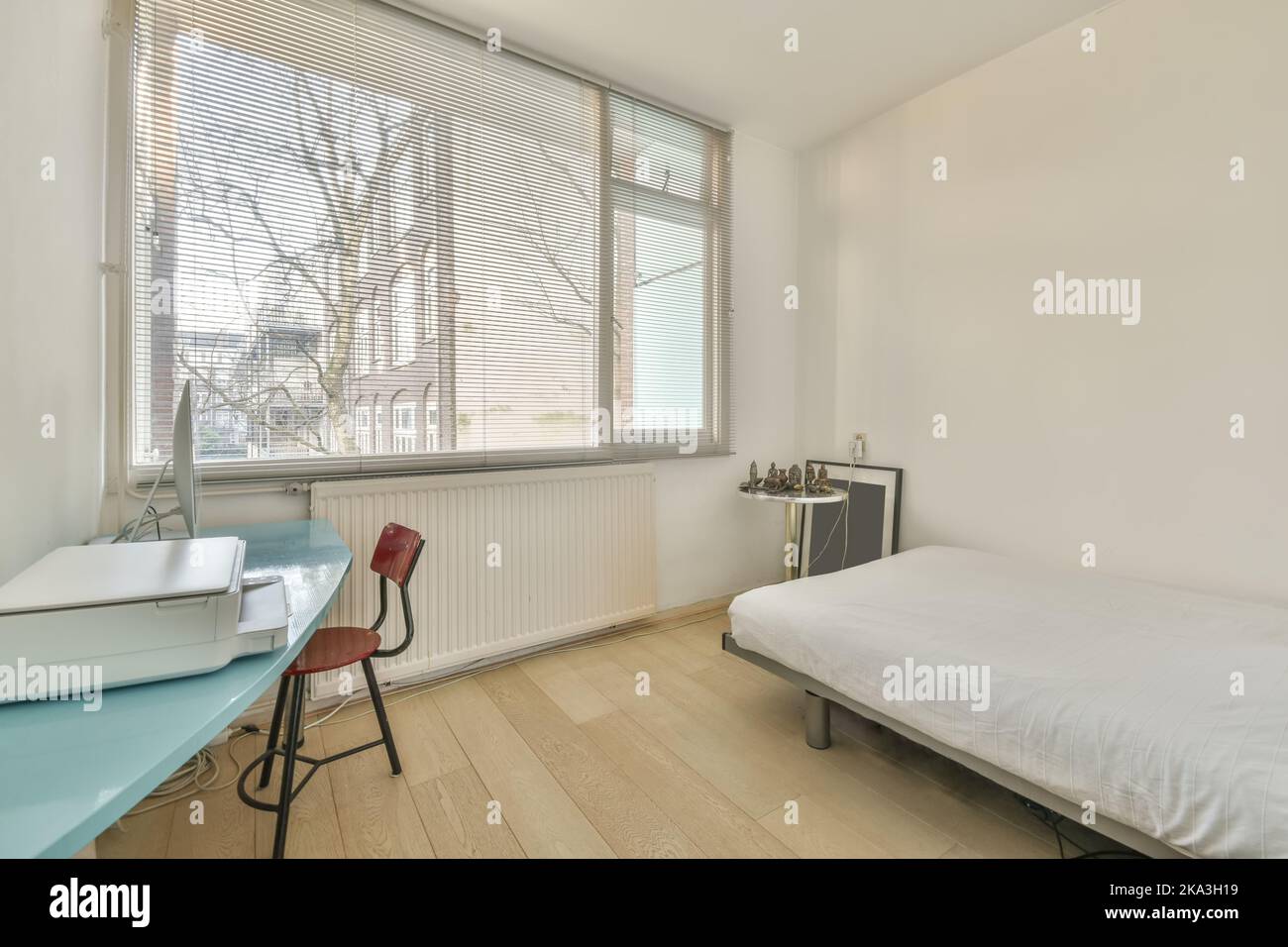 Interior of modern bedroom with workspace with computer placed on desk ...