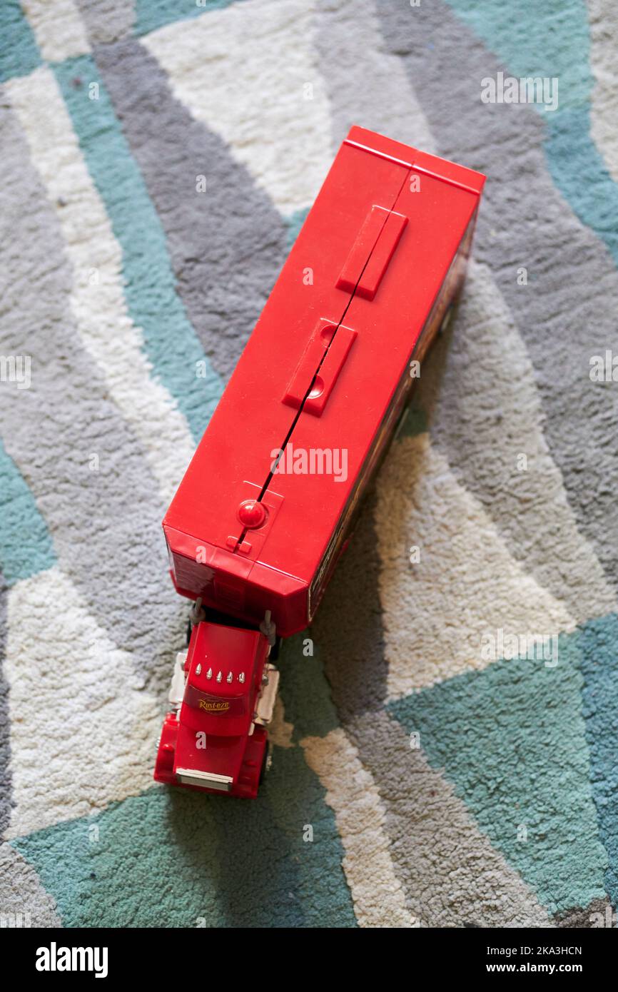 A top view shot of a red Mattel toy model truck from the Disney Pixar ...
