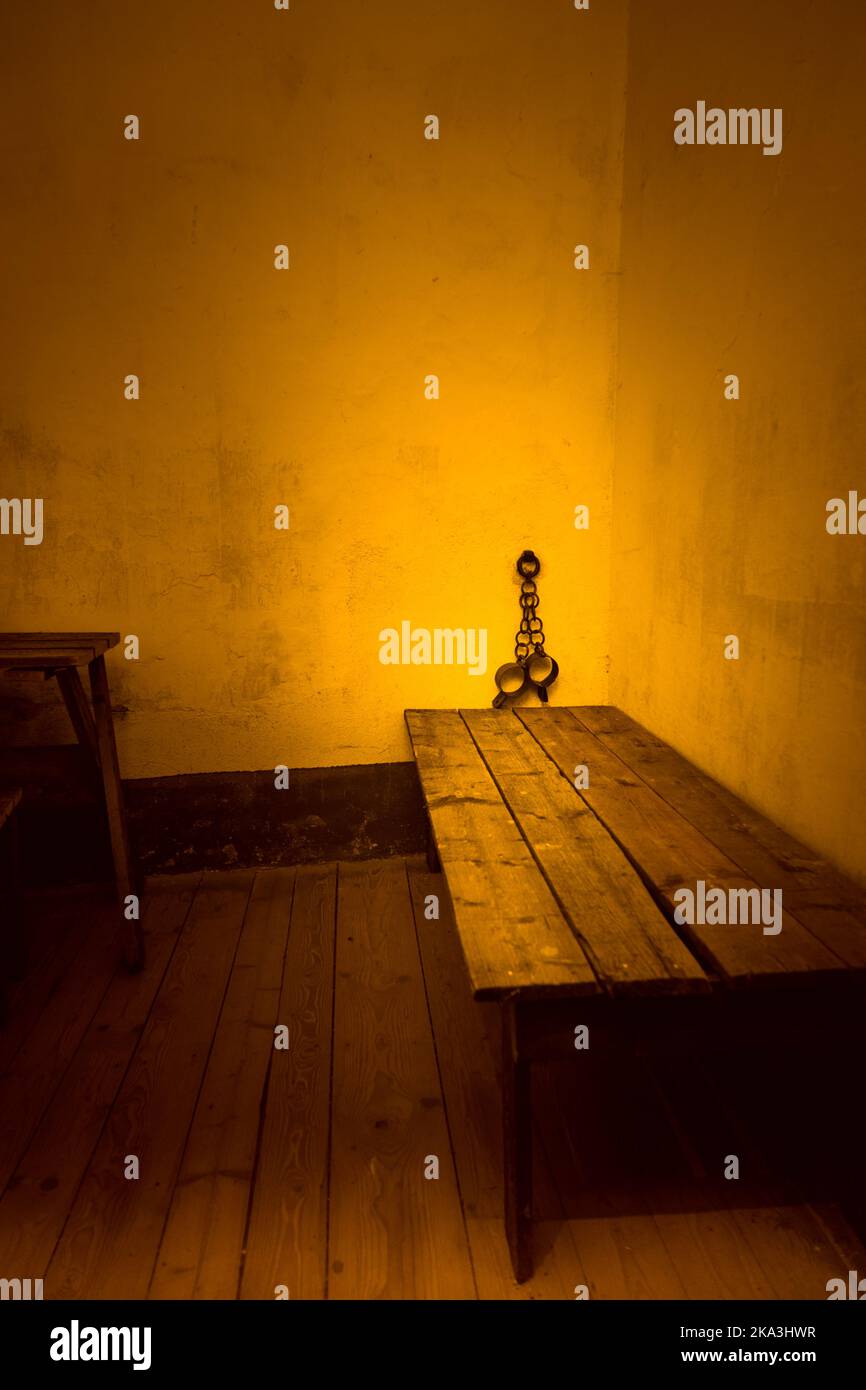 A simple wooden bench with manacles at the Terezin concentration camp ...