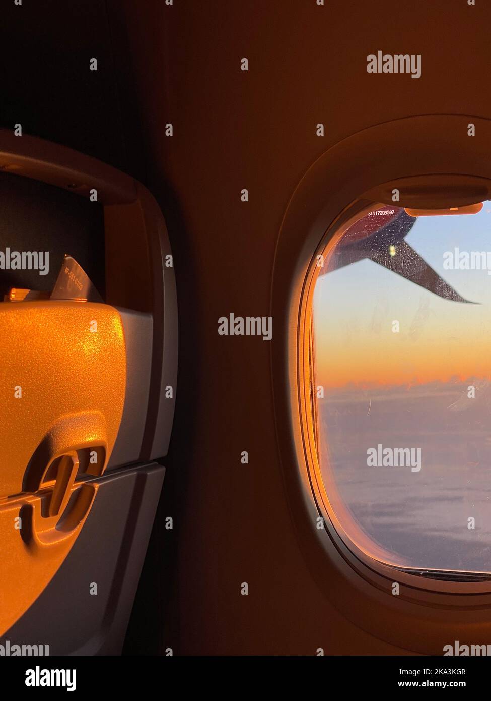 A view of plane interior with window and seats Stock Photo - Alamy