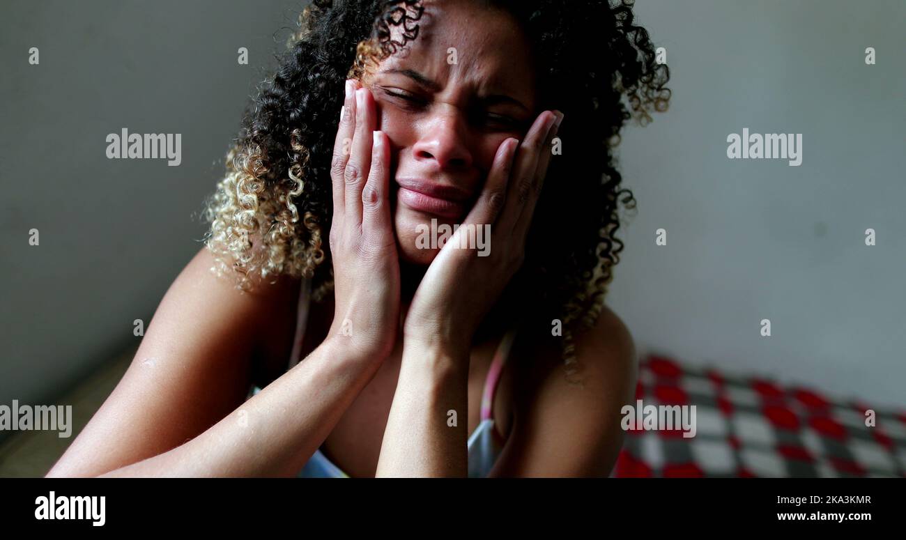 Desperate depressed woman crying in despair, crying person hispanic ...