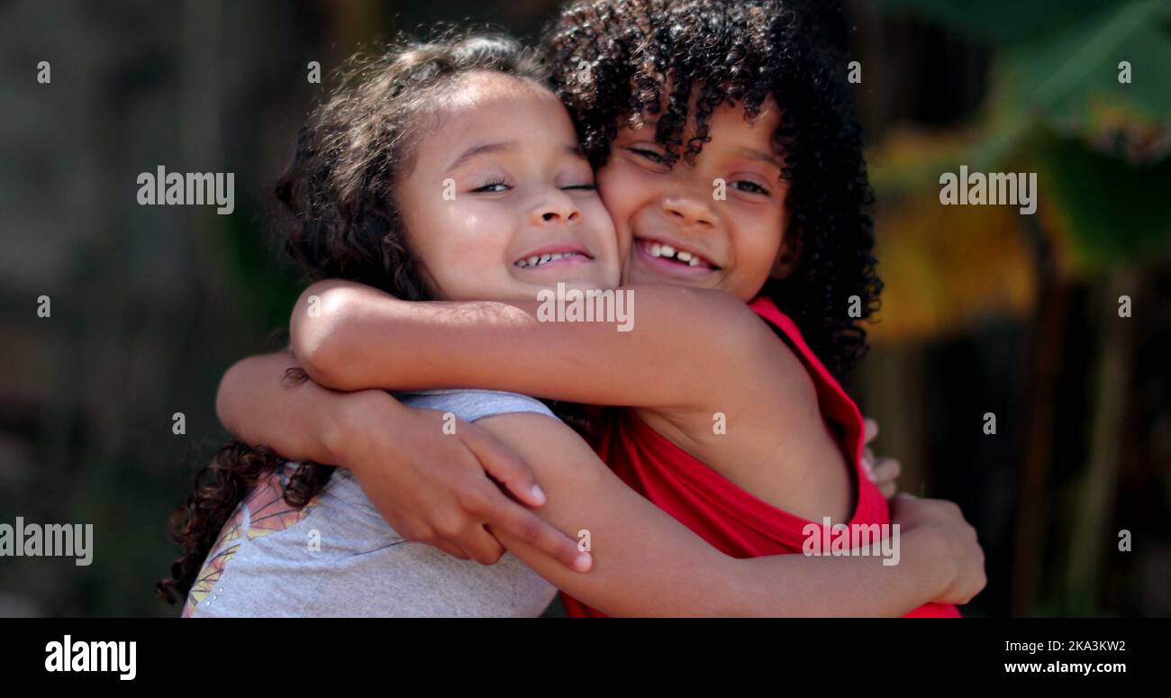 Children hugging each other. Two little hispanic girls embrace2 Stock ...