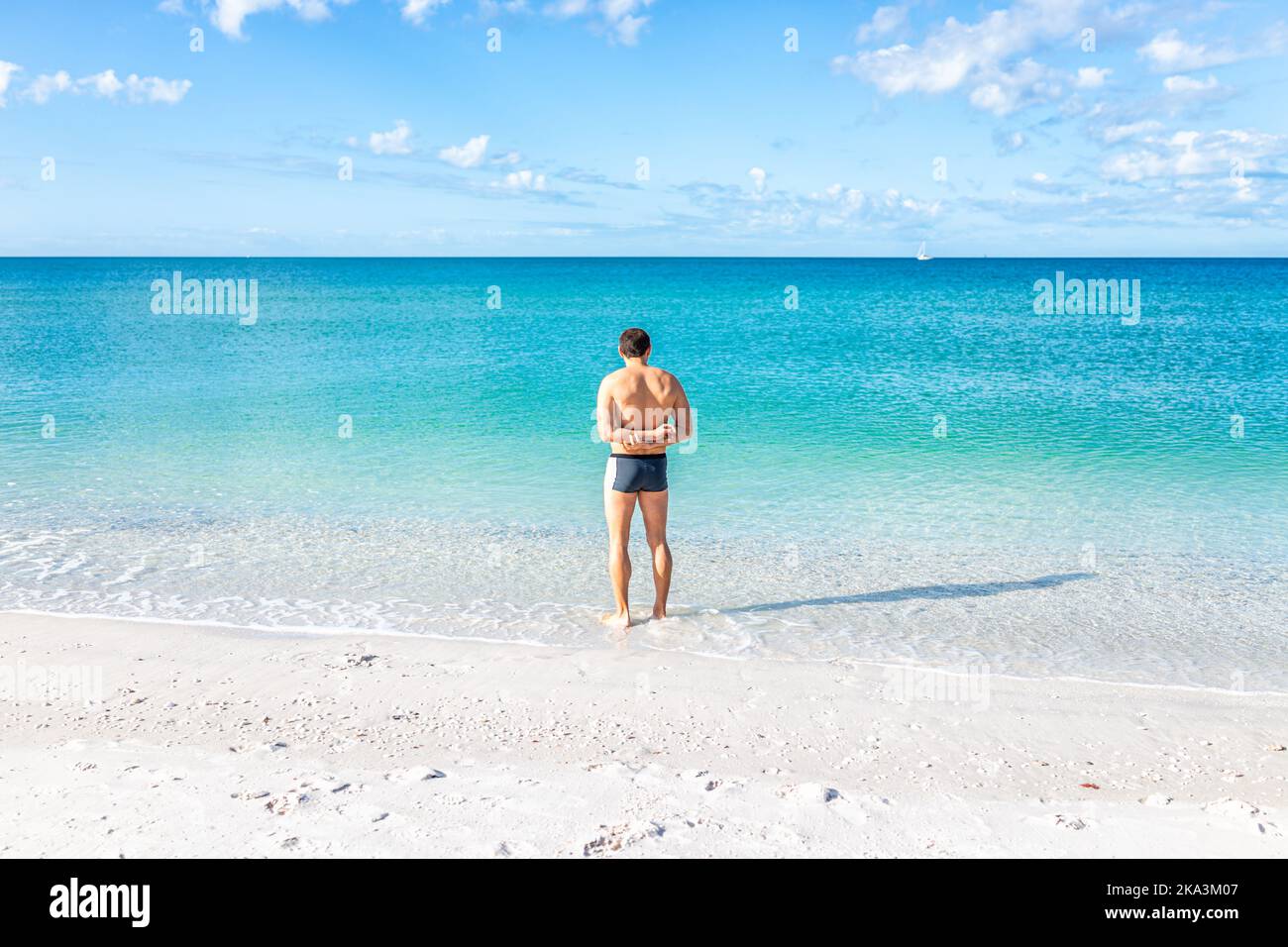 Young fit muscular adult man at Barefoot beach of Bonita Springs near ...