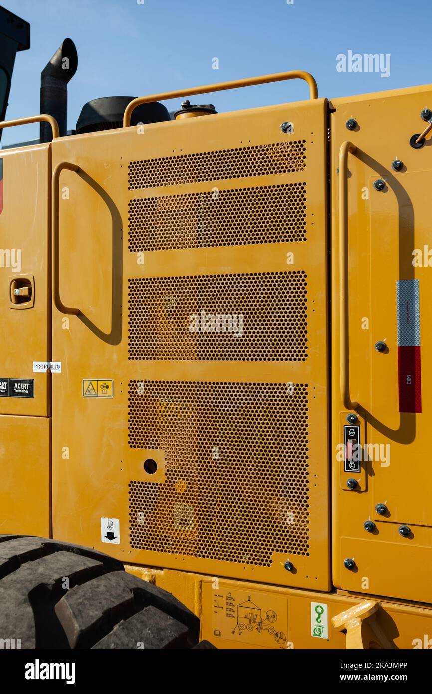 A vertical shot of a big yellow bulldozer in sunny weather Stock Photo ...