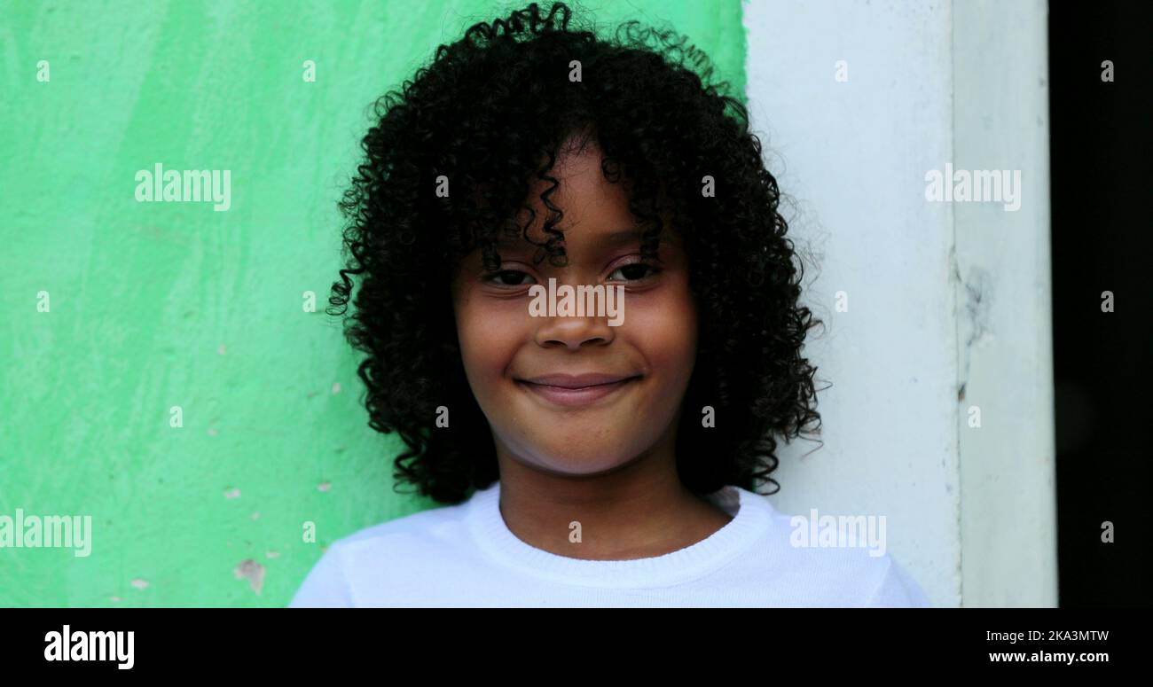 Happy black African child girl smiling at camera portrait face Stock ...