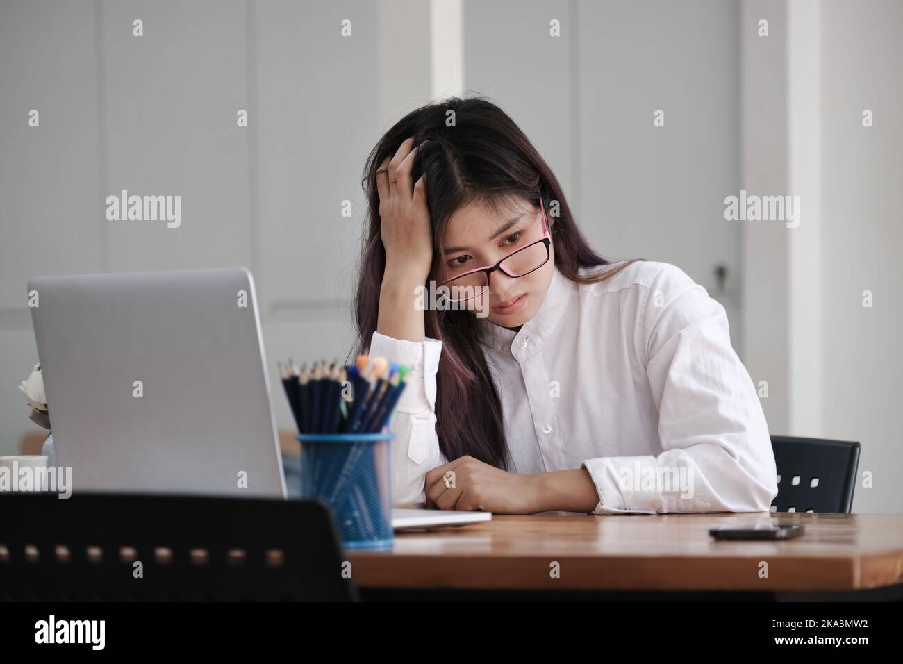 Employees show signs of boredom from working full time Stock Photo - Alamy