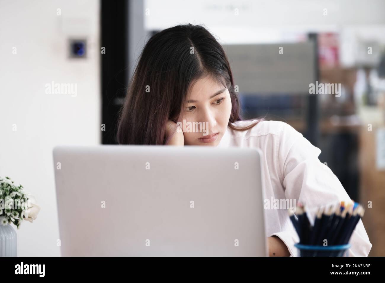 Employees show signs of boredom from working full time Stock Photo - Alamy