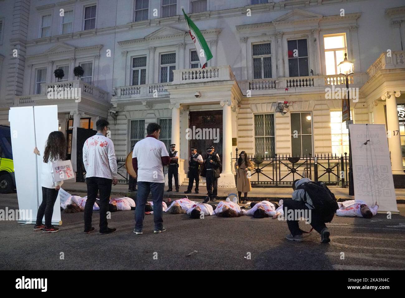 Activists gather outside the Iranian Embassy in London in a show of ...