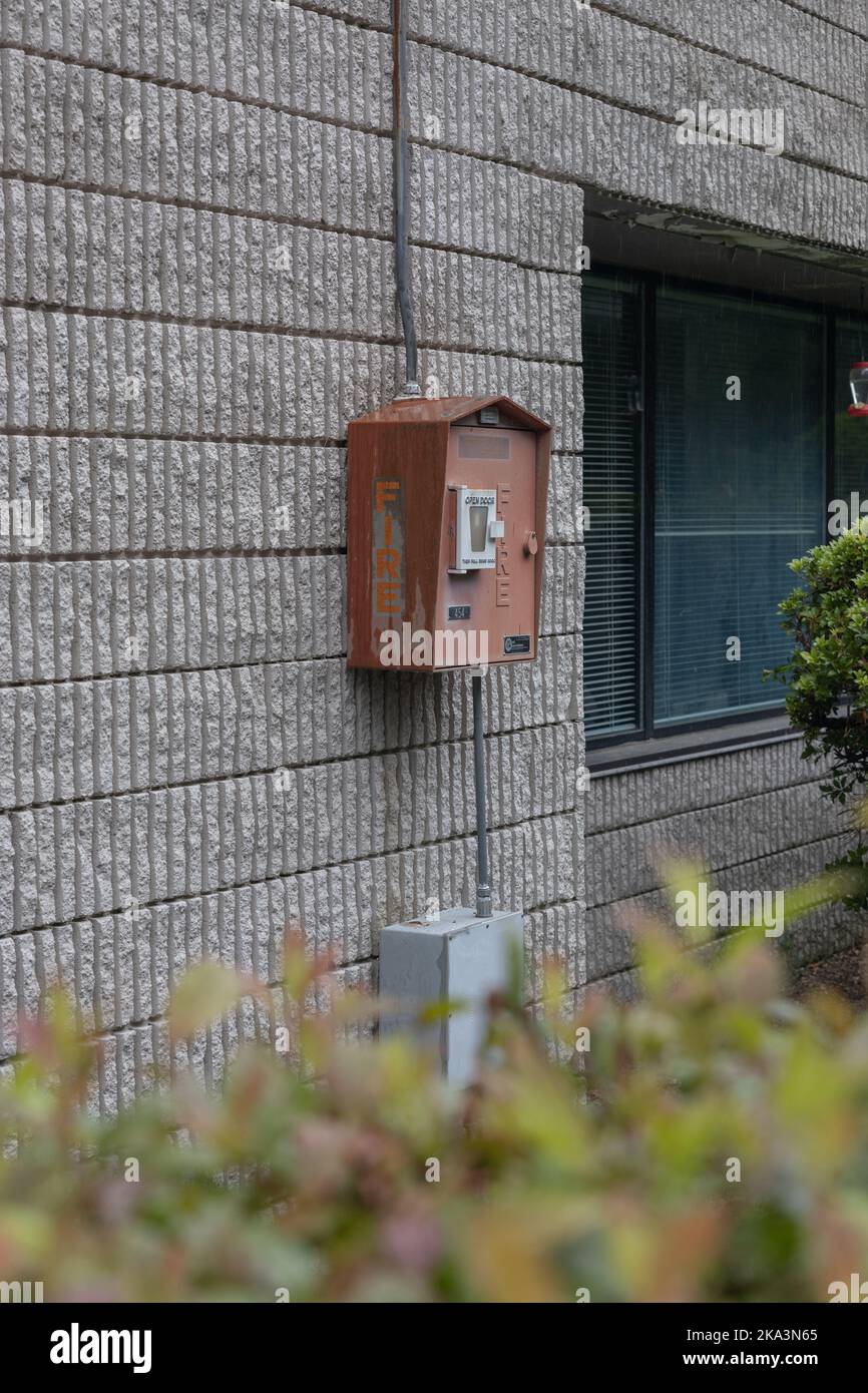 A vertical shot of a fire department fire alarm box outside a ...