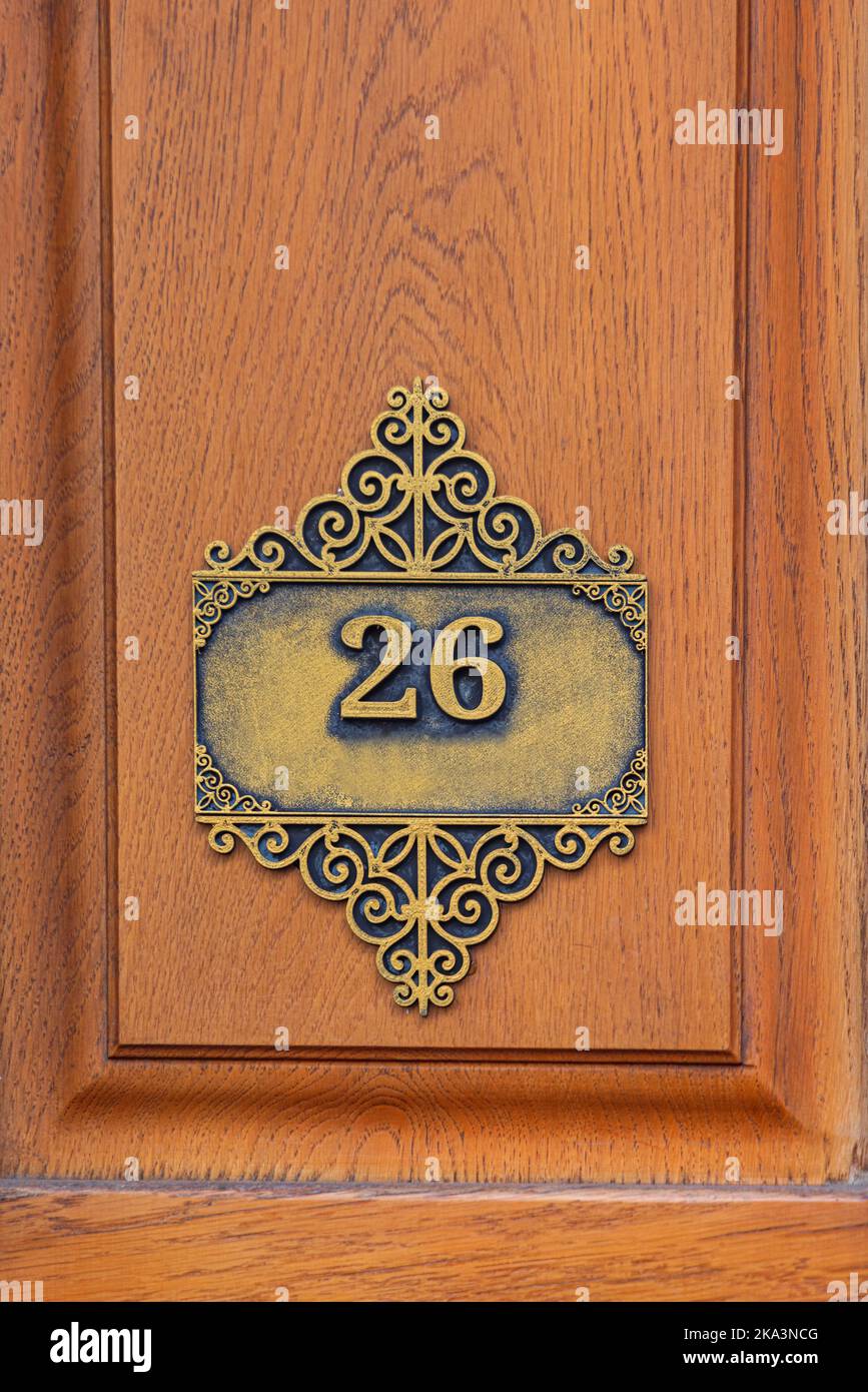 Engraved Number Twenty Six at Wooden Door Stock Photo - Alamy