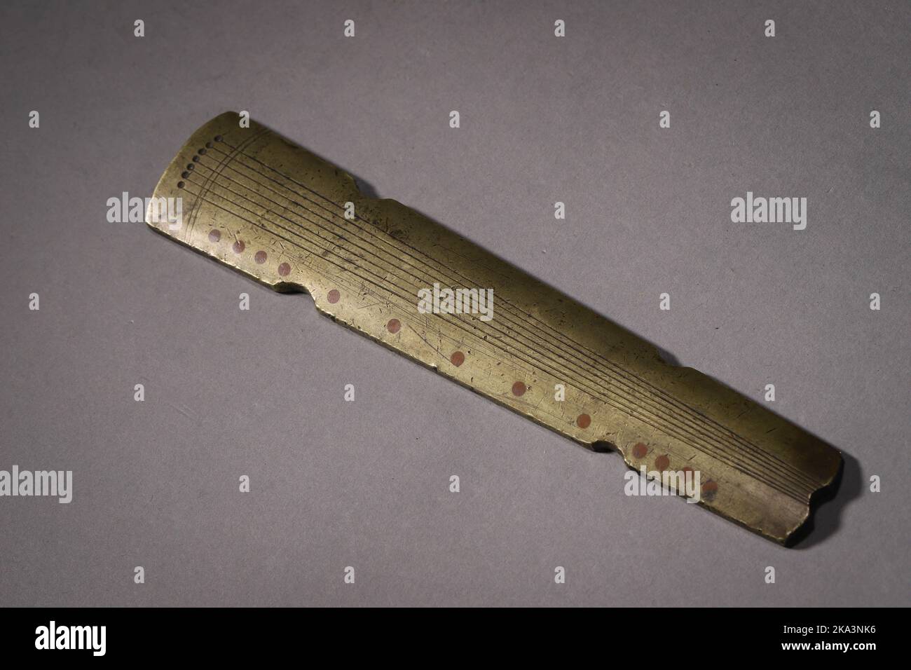 A Guqin (traditional Chinese musical instrument) on a gray background ...