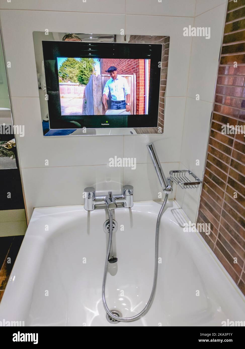 LCD Television in the wall above a bath Stock Photo - Alamy