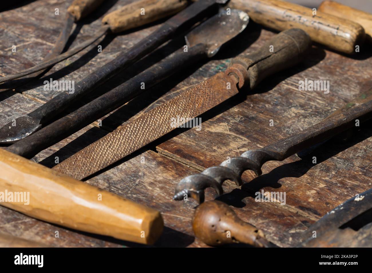 Antique artisan carpenter's tools on a wooden board, selective approach ...