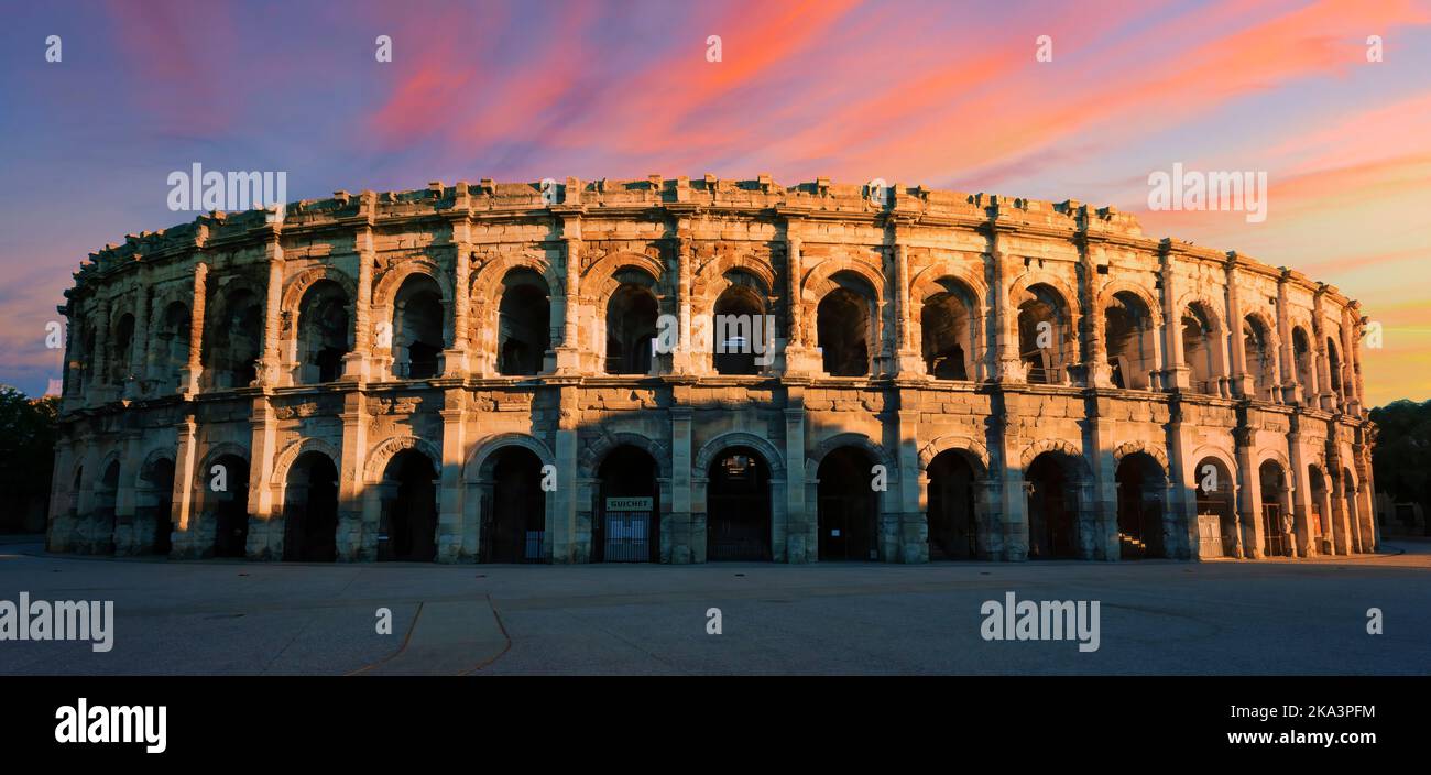 Famous arena at sunrise, Nimes, France Stock Photo - Alamy