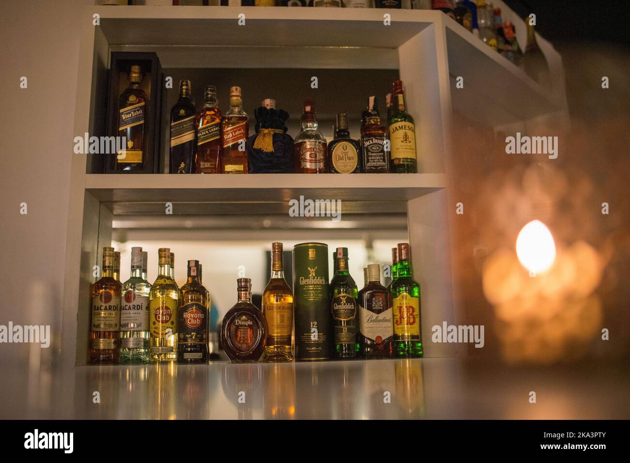 Different alcohol bottle on the shelf of a restaurant bar Stock Photo ...