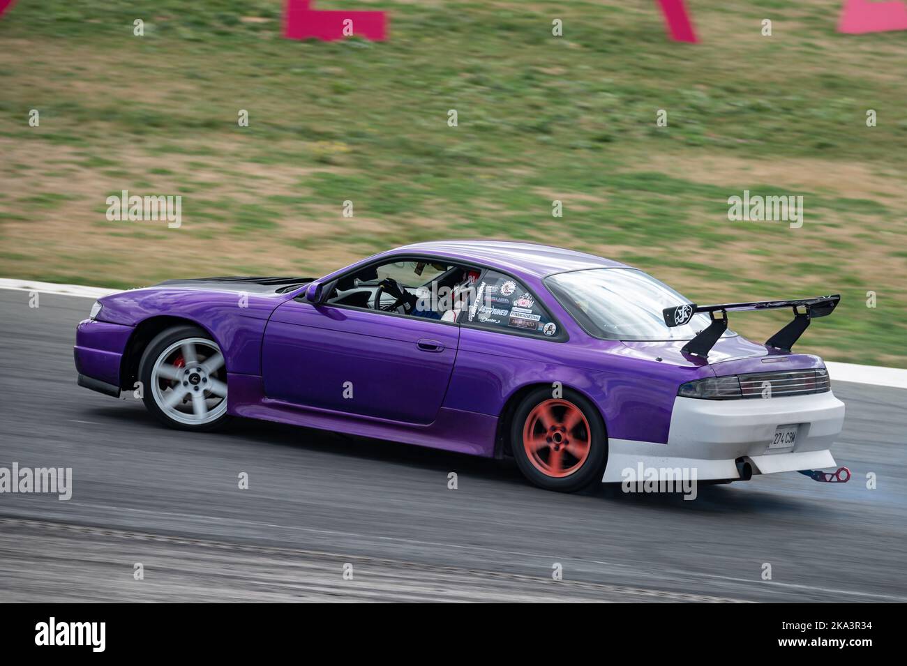 Nissan Silvia S14 in purple drifting on the track Stock Photo - Alamy