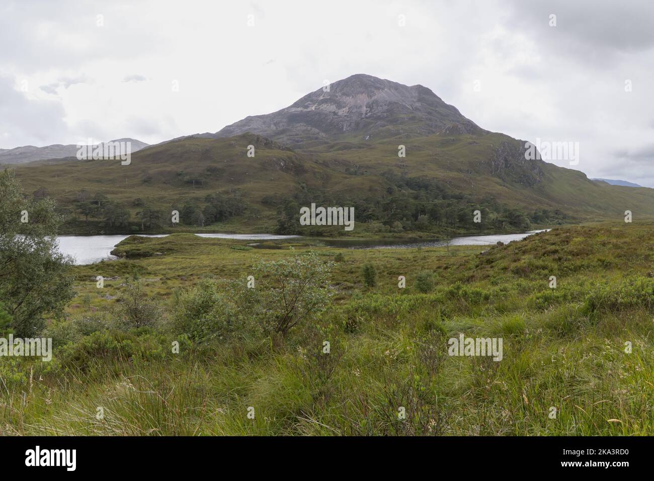 A beautiful view of a landscape with a river and mountains under the ...