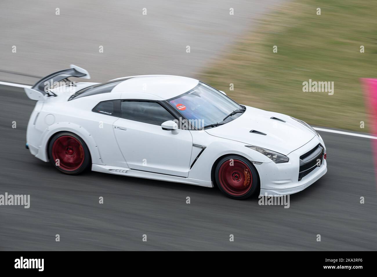 Nissan Skyline GT-R R35 racing on the race track Stock Photo - Alamy