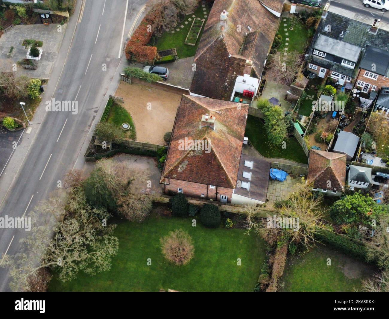 The top view of the house roofs with green lawns near the road Stock ...