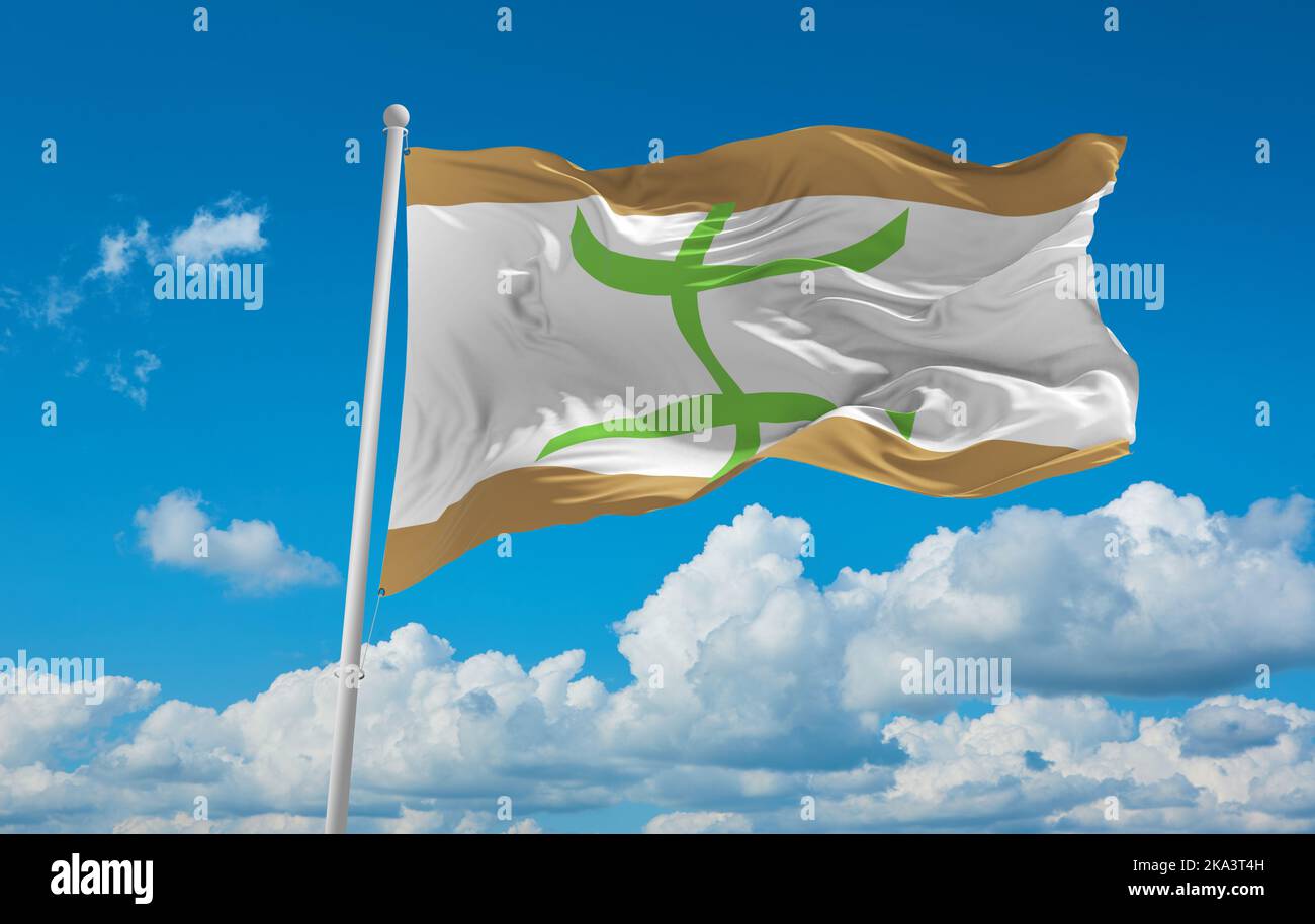 flag of Berbers Mozabite people at cloudy sky background, panoramic ...