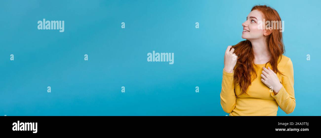 Portrait of happy ginger red hair girl with freckles smiling looking at ...