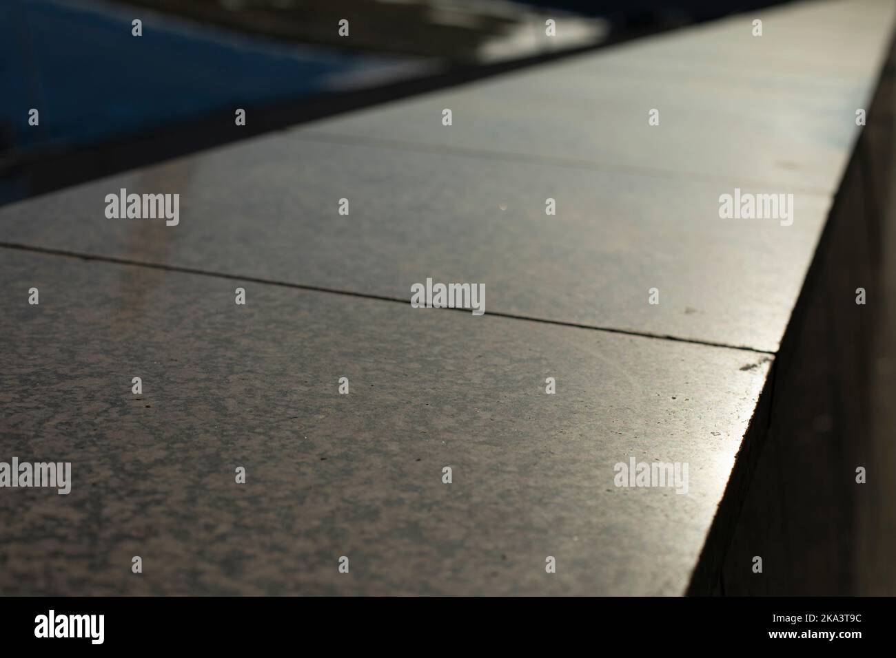 Granite tiles. Facade cladding. Details of building. Parapet in city ...