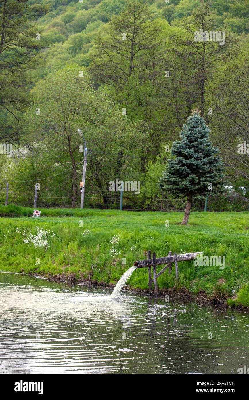 Wastewater discharge through a pipe, eco, toxic, waste Stock Photo - Alamy