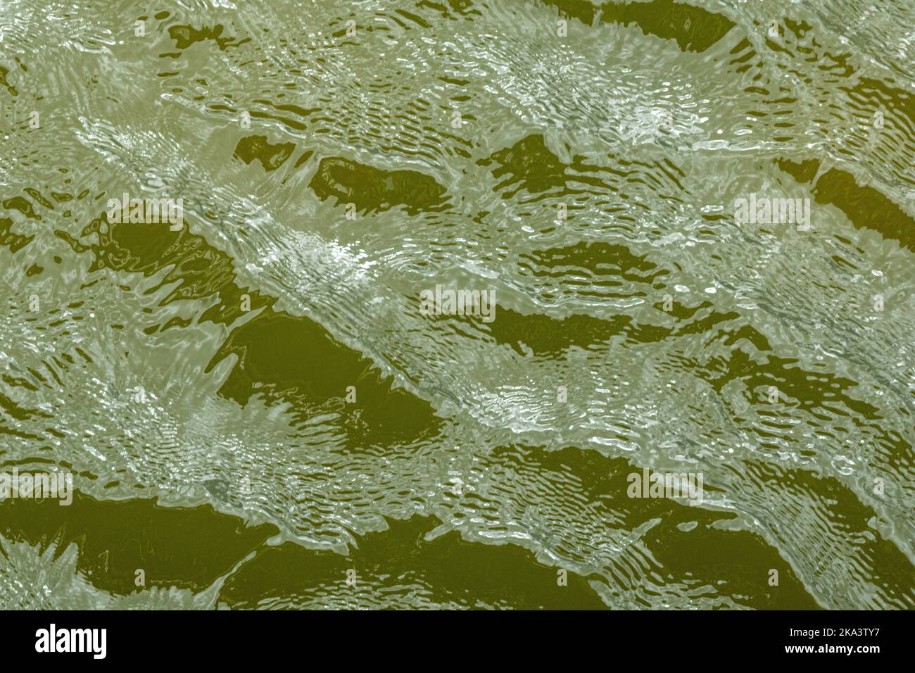Horizontal photo of gentle wave texture on green water surface Stock ...