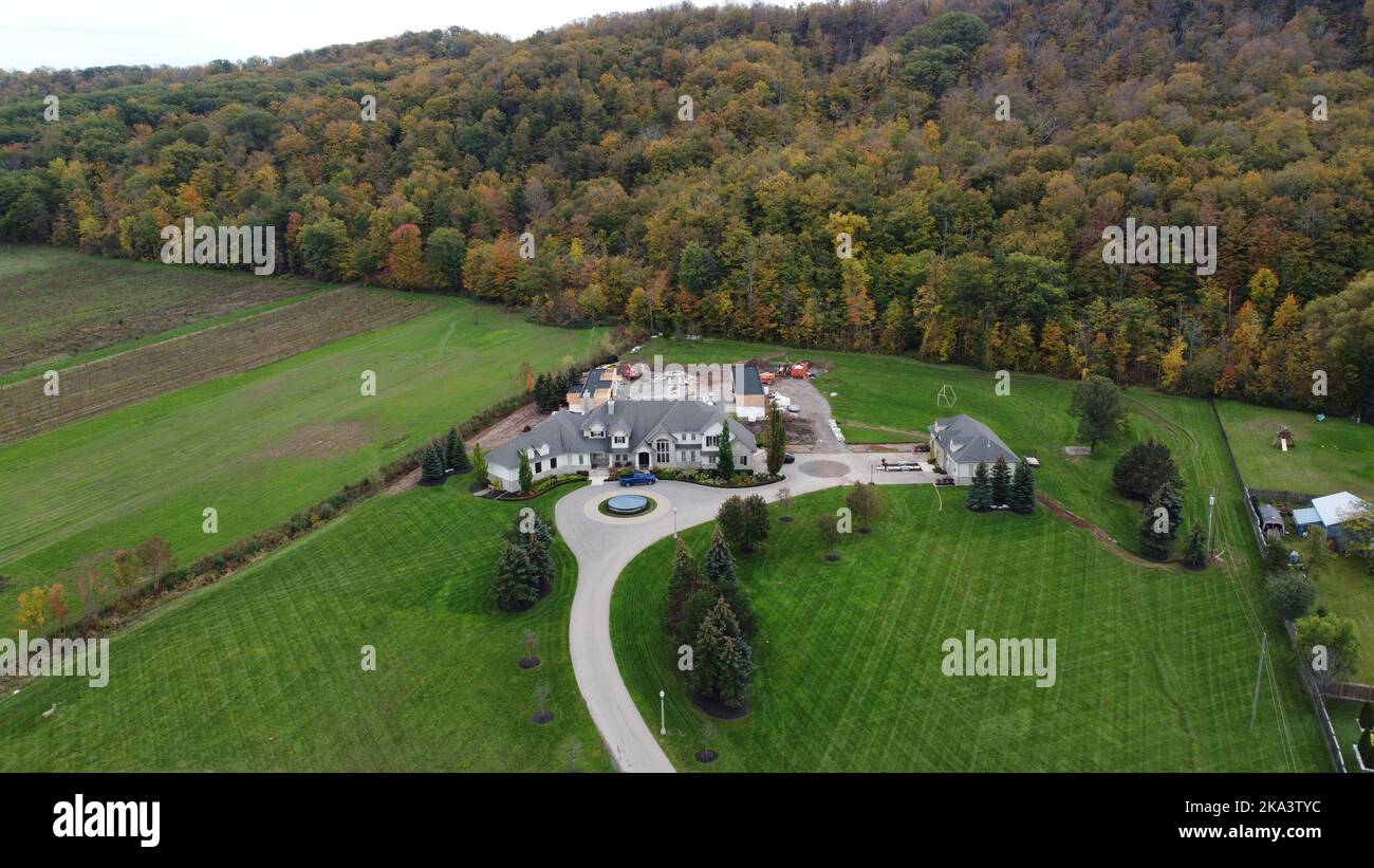 An aerial view of a small village near a forest in the countryside ...
