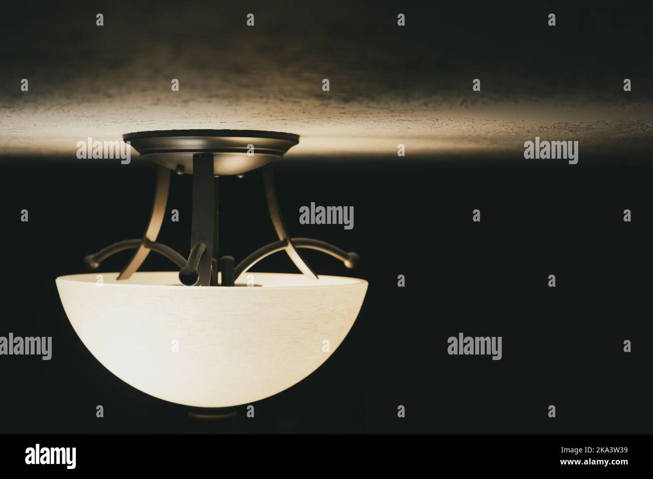 Eye level view of a modern light fixture on a white ceiling Stock Photo ...