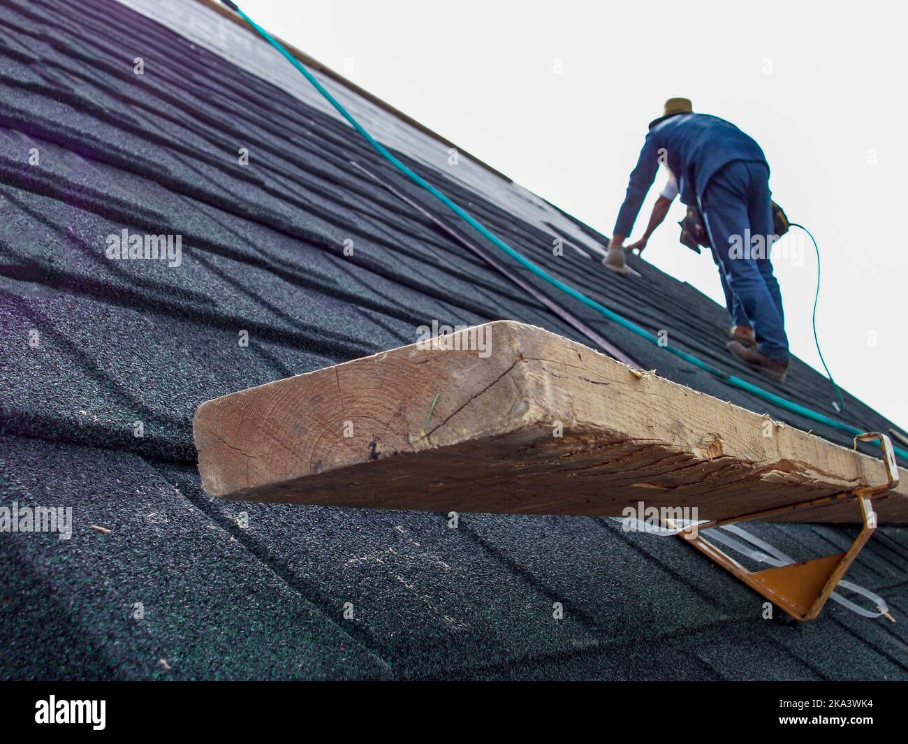 Support bracket and foot support on shingle roof installation Stock ...