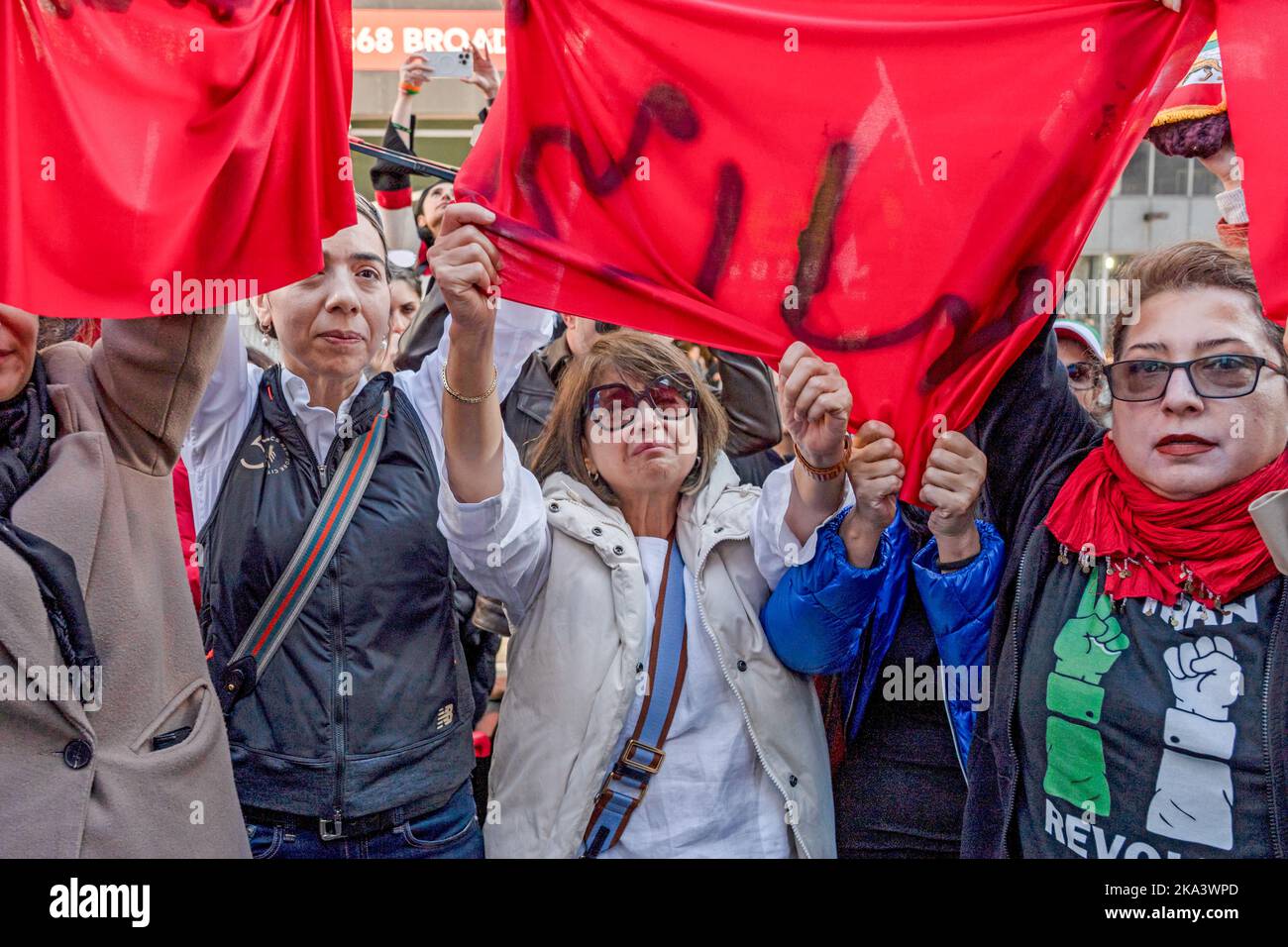 New York, United States. 29th Oct, 2022. Emotional protesters sing ...