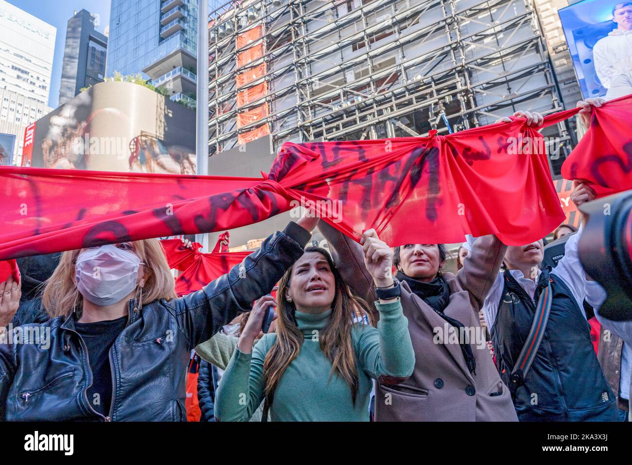 Emotional protesters sing during a protest in Times Square in ...