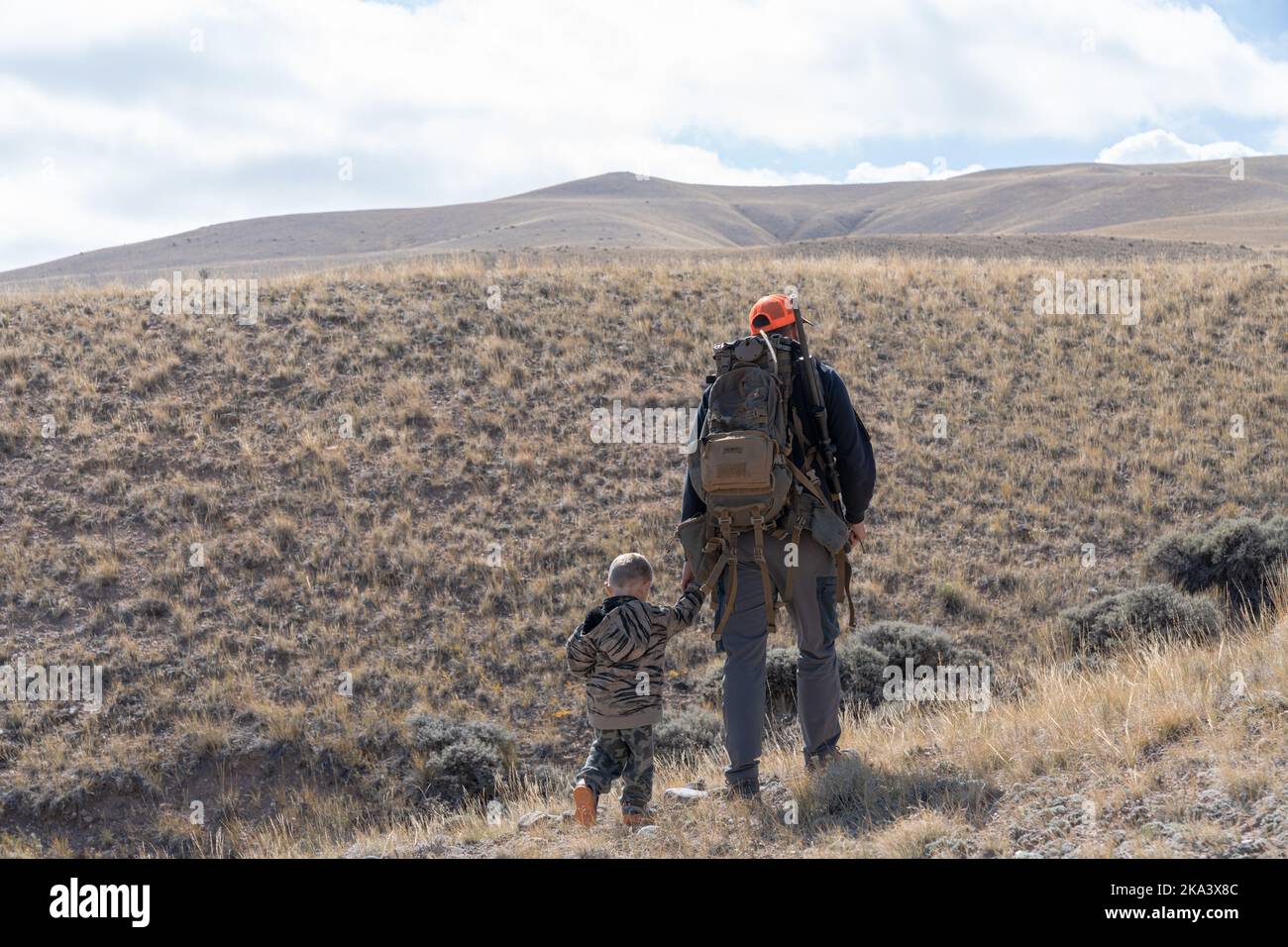 Wyoming, USA - October 7, 2022: Father and son walk in the sagebrush ...