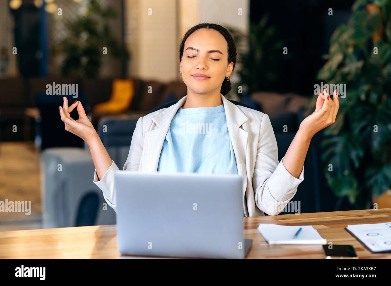 Meditation, relaxation. Calm beautiful mixed race business woman ...