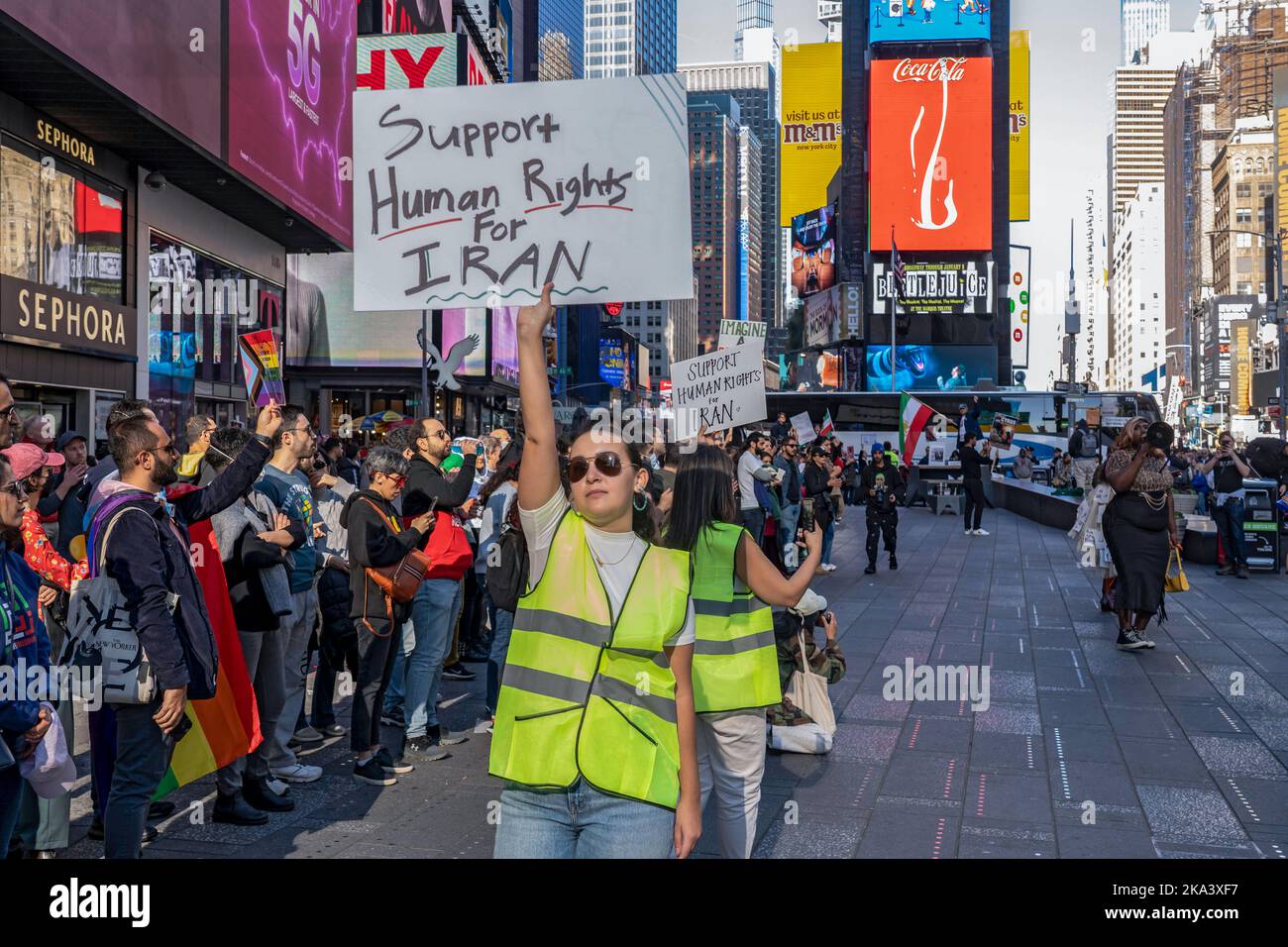 Activist holds a "Support Human Rights For Iran" placard during a ...