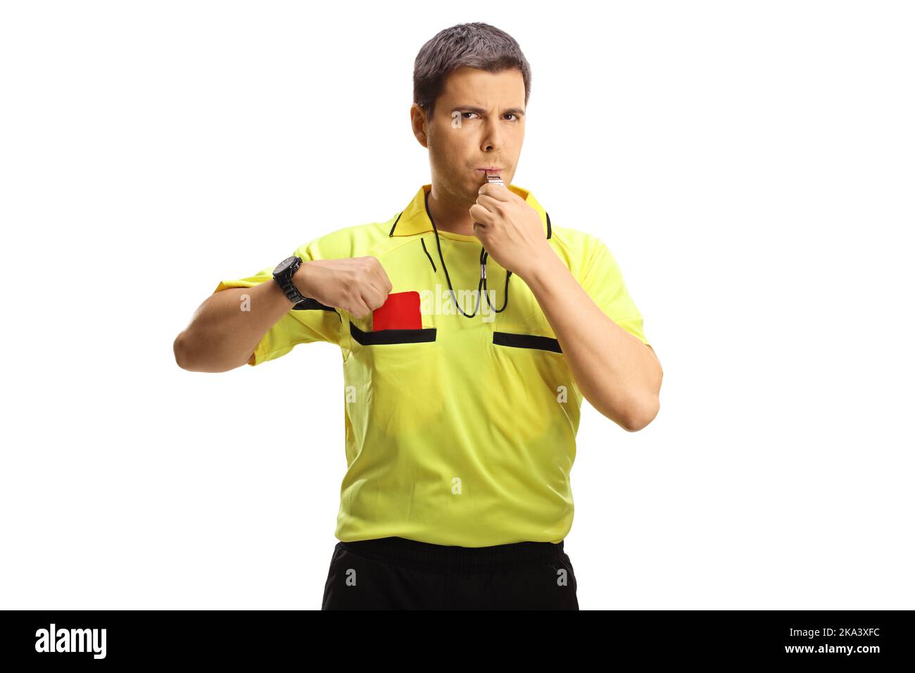 Football referee blowing a whistle and taking a red card out of pocket ...