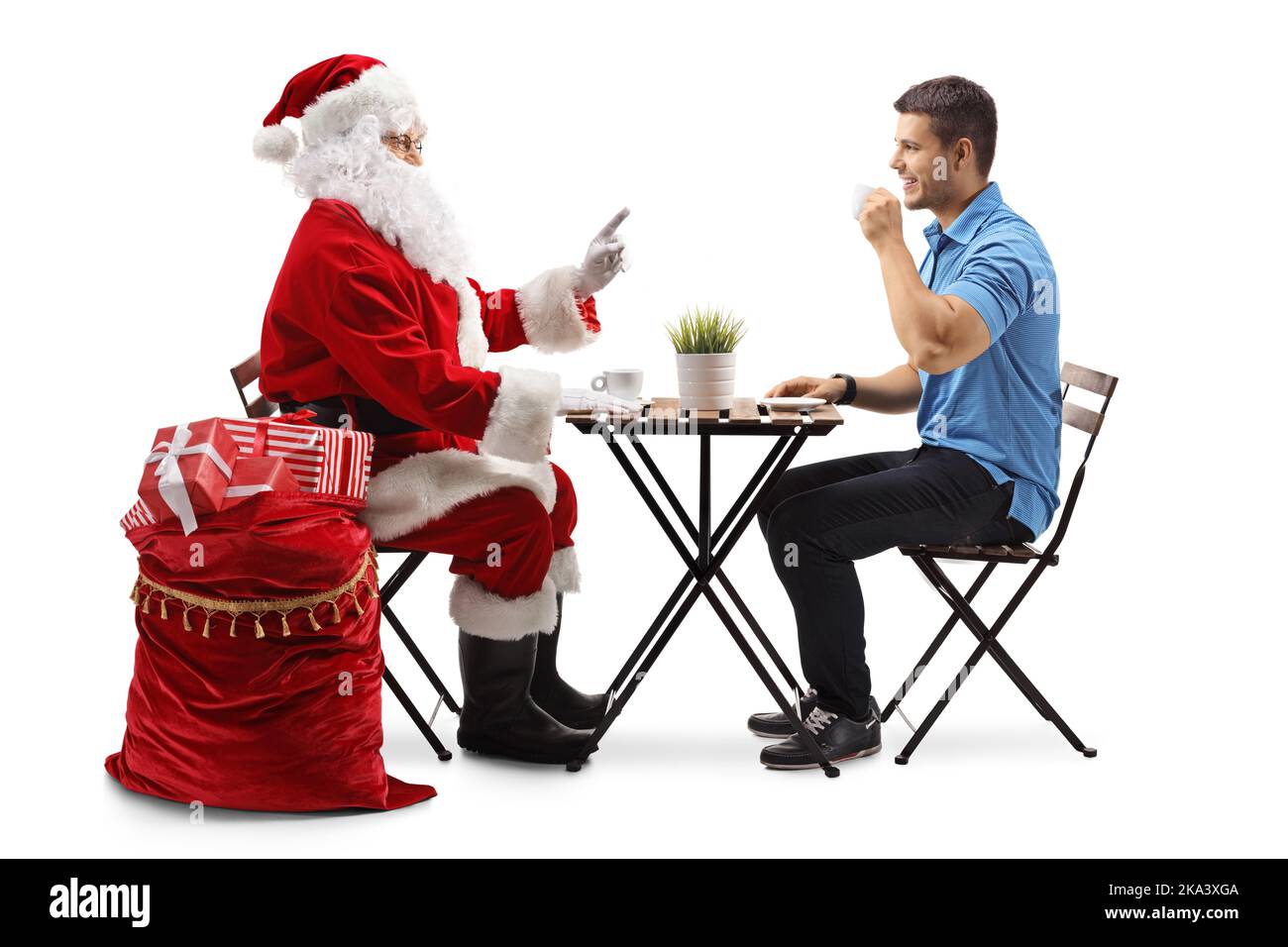 Santa Claus talking to a young man in a cafe isolated on white ...