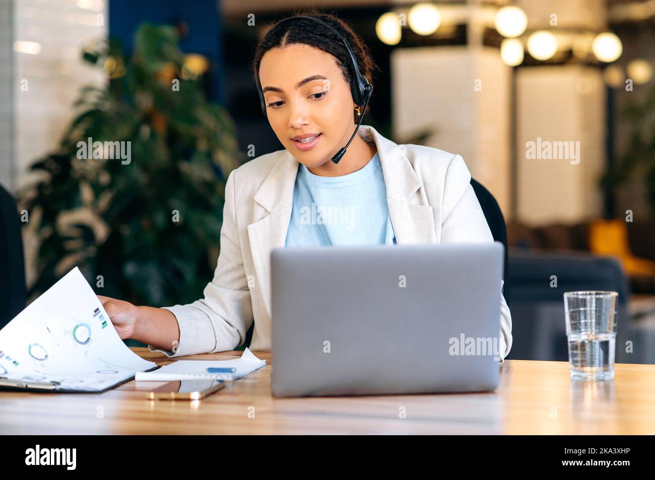 Busy focused brazilian or hispanic businesswoman, consultant, call ...