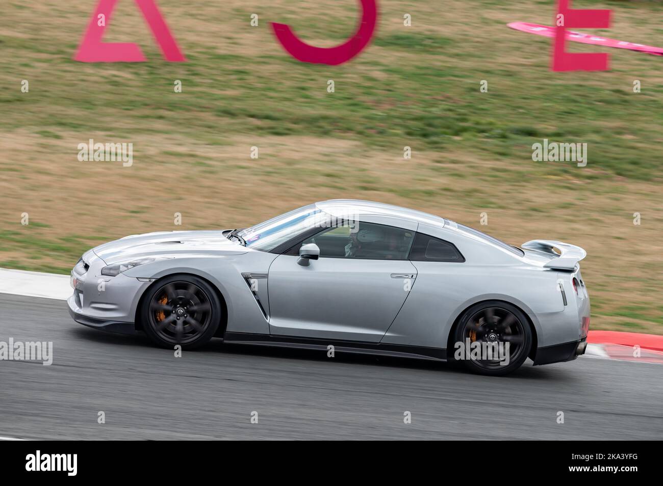 Nissan Skyline GT-R R35 racing on the race track Stock Photo - Alamy