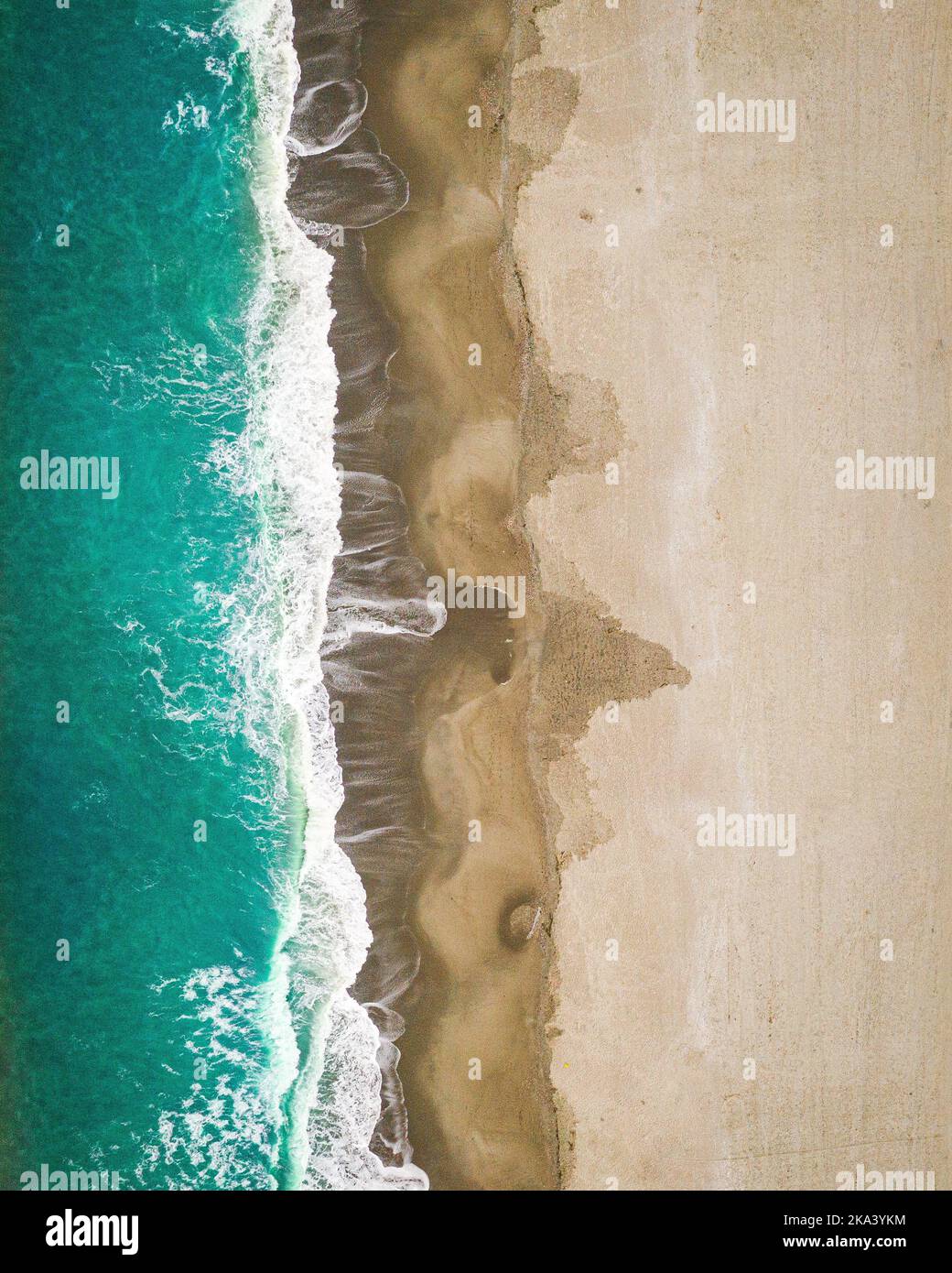 A mesmerizing aerial top view of sea waves washing the shore Stock ...