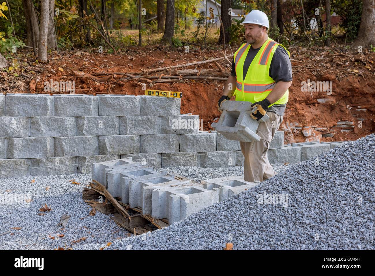 Building retaining wall with retaining blocks on new property is being ...