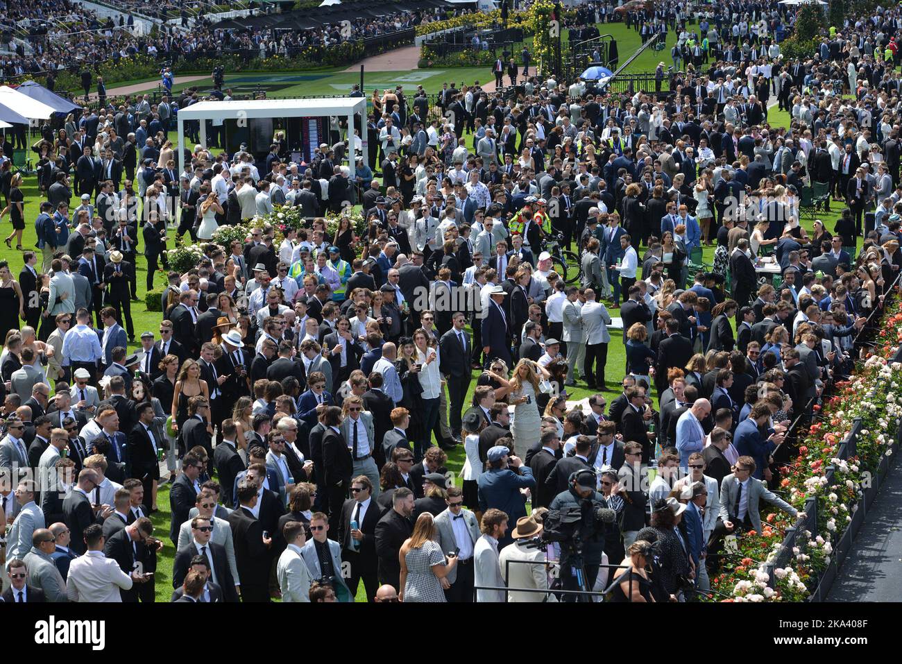 Jockeys and people take part during Melbourne Cup Carnival 2022 at ...