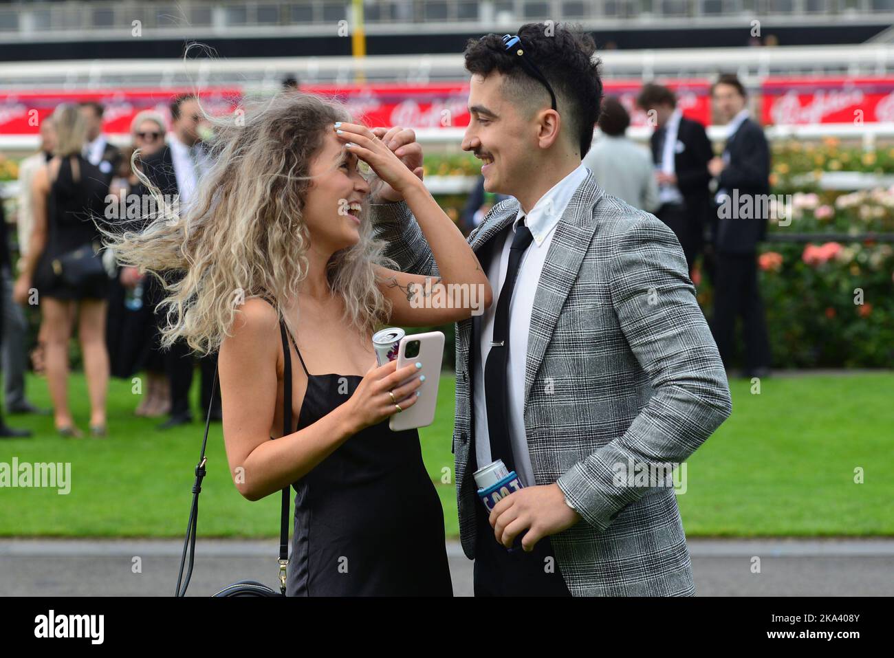 Jockeys and people take part during Melbourne Cup Carnival 2022 at ...