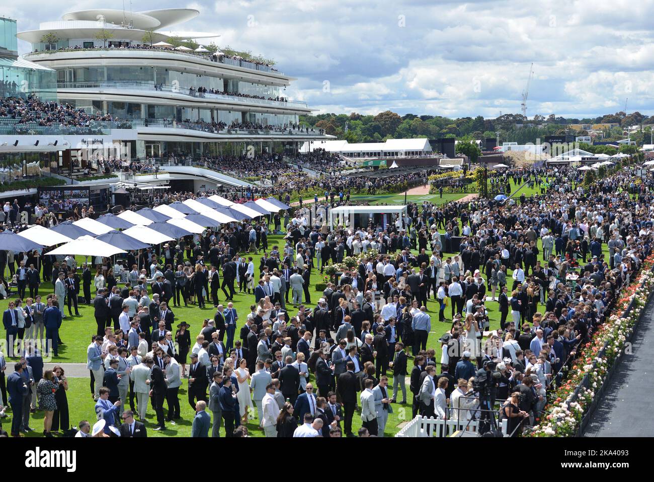 Jockeys and people take part during Melbourne Cup Carnival 2022 at ...