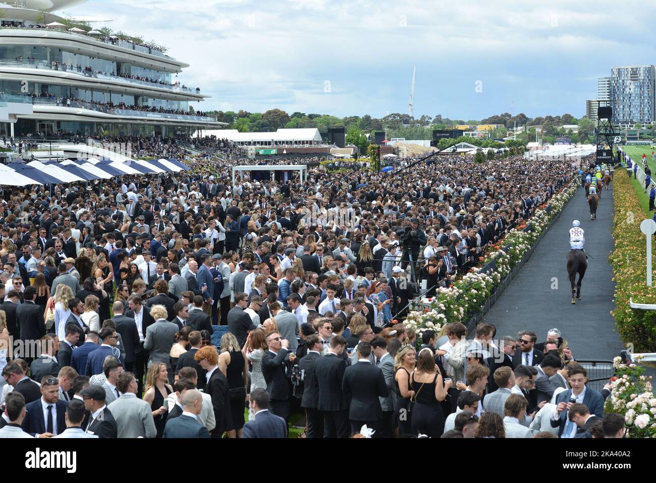 Jockeys and people take part during Melbourne Cup Carnival 2022 at ...